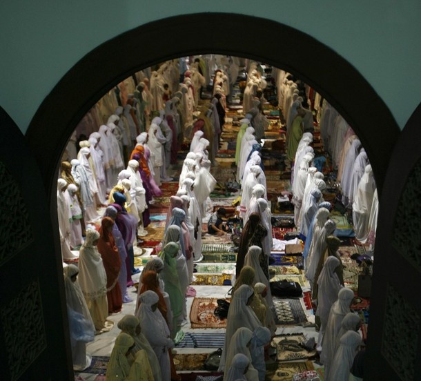 Muslims attend a mass prayer session “Tarawih”, marking the beginning ...